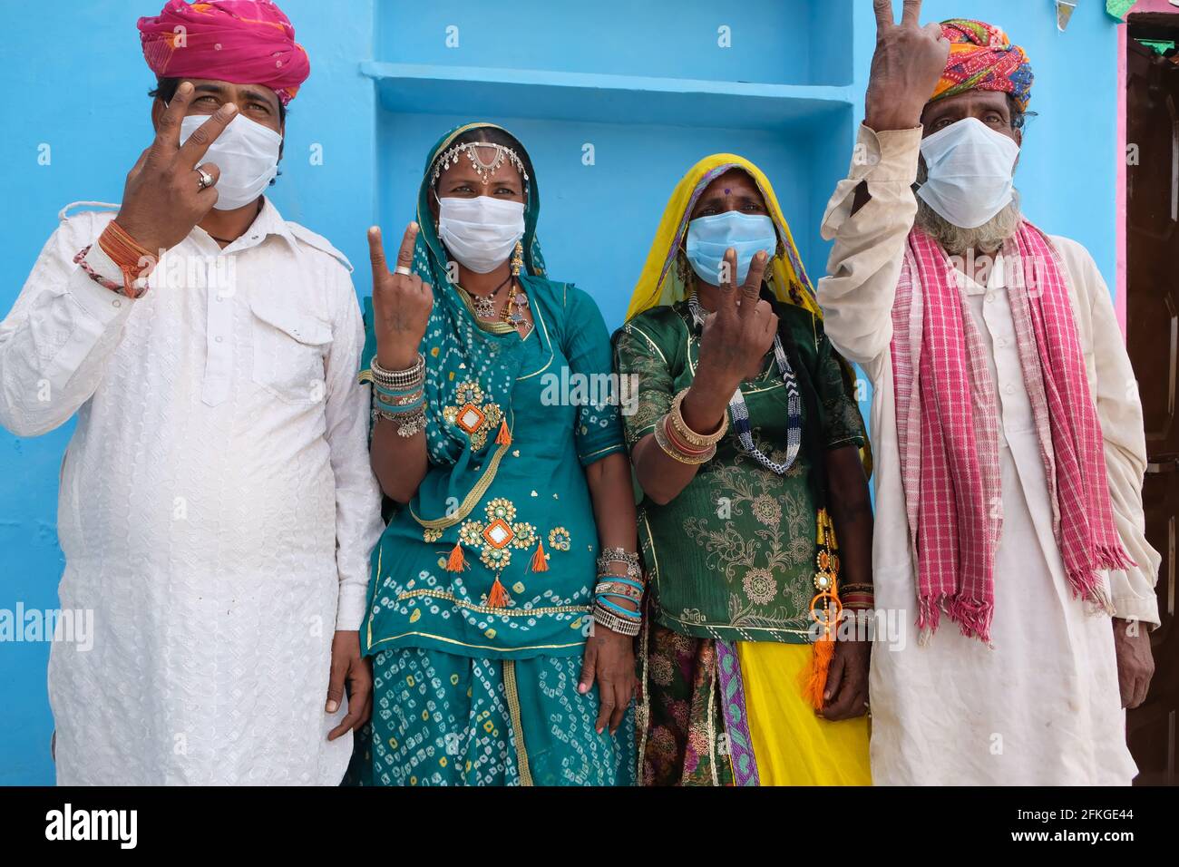 Closeup shot of South Asian males and females in traditional clothing ...