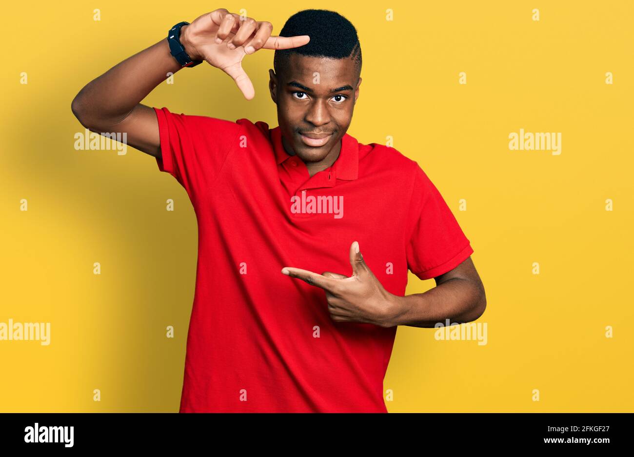 Young african american man wearing casual red t shirt smiling making ...