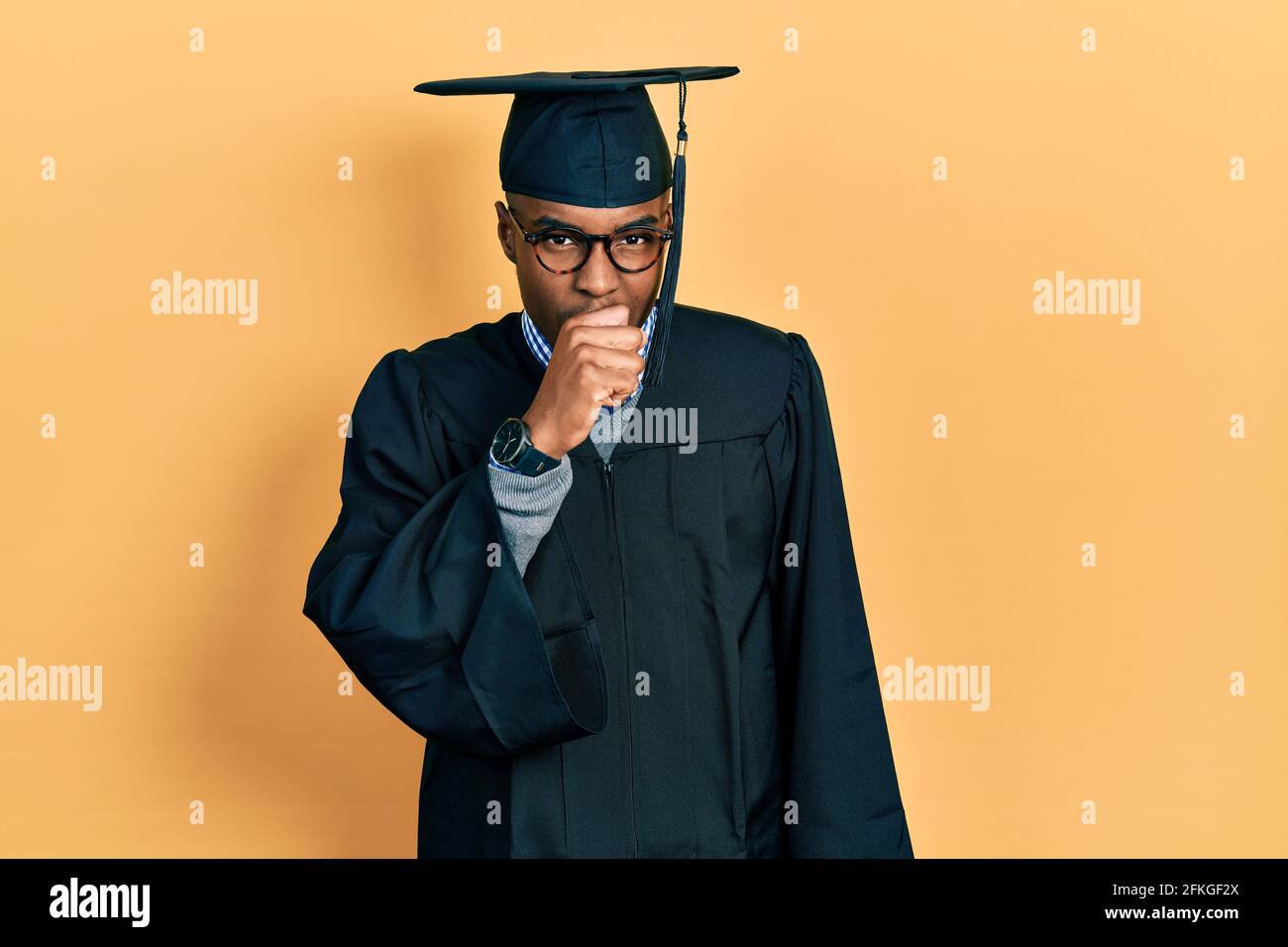 Young african american man wearing graduation cap and ceremony robe ...