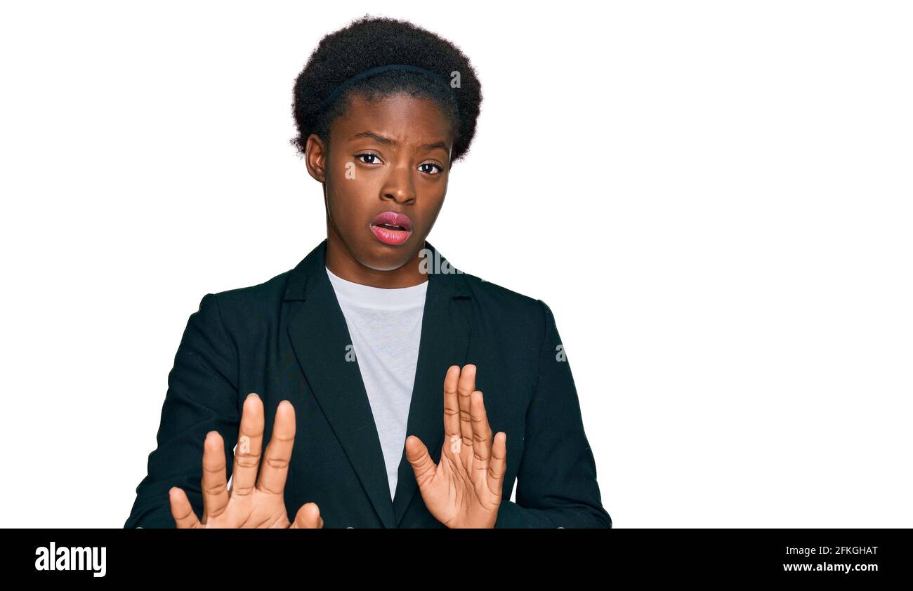 Young african american girl wearing business clothes moving away hands ...