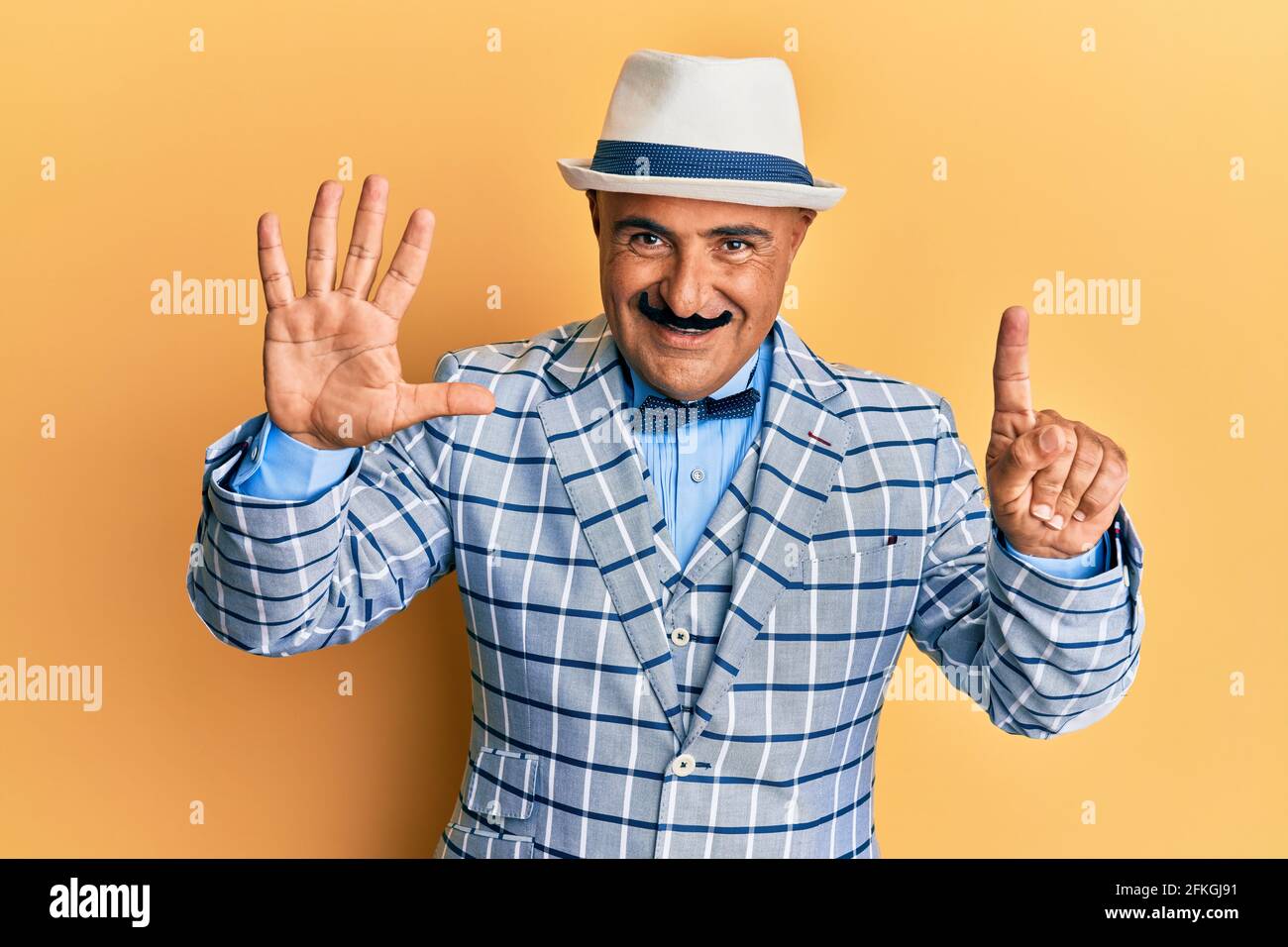 Mature middle east man with mustache wearing vintage and elegant ...