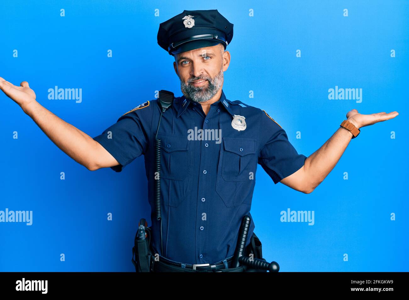 Middle age handsome man wearing police uniform clueless and confused ...