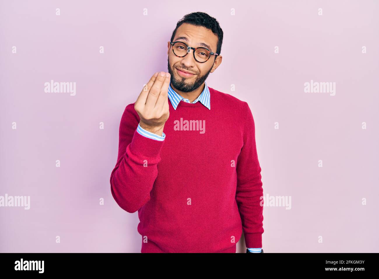 Hispanic man with beard wearing business shirt and glasses doing ...