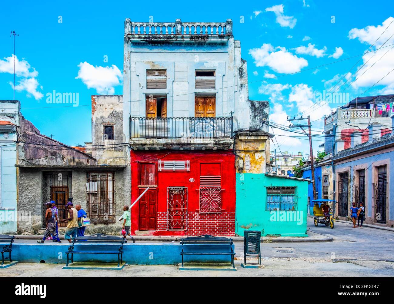 Havana, Cuba, July 2019, Construction Workers walking by some colorful ...