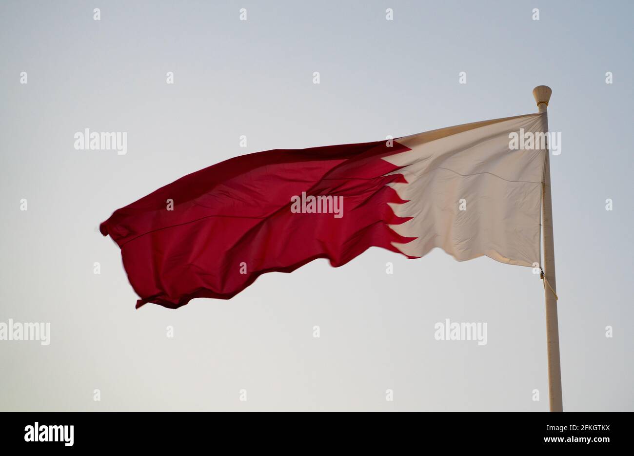 National flag of Qatar flying high. qatar flag Stock Photo - Alamy