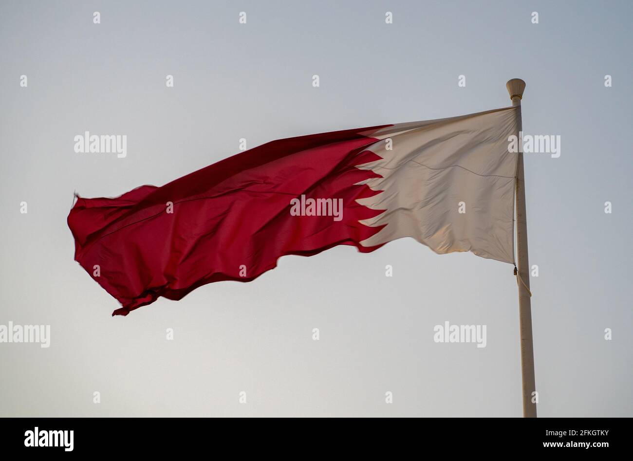 National flag of Qatar flying high. qatar flag Stock Photo - Alamy