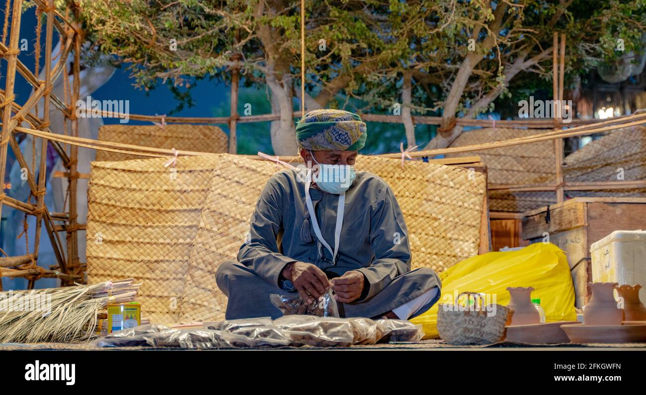 Doha,Qatar- 04 December 2020 : A vendor at a stall during the show ...