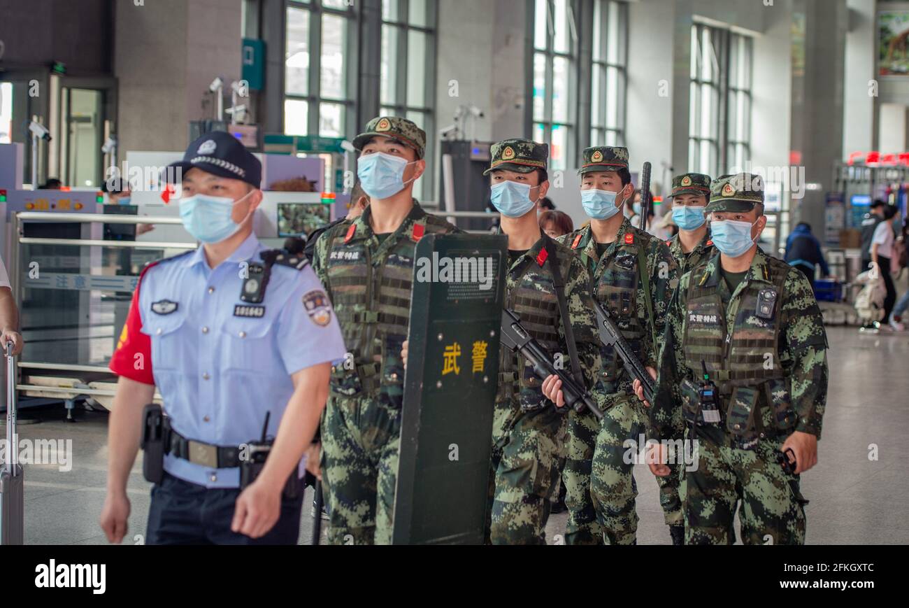 GUIGANG, CHINA - MAY 1, 2021 - Armed police officers and public ...