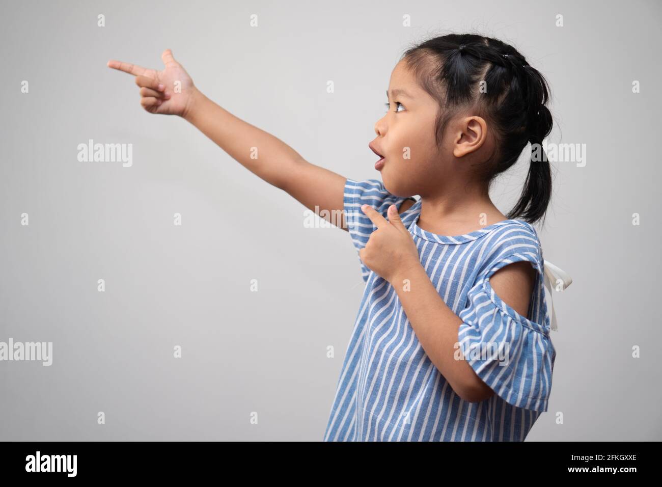 Portrait of Asian child and to collect hair and Put your index finger ...