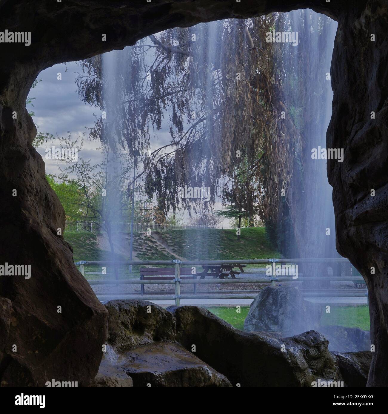 Stunning view of a flood waterfall from the cave in the park Stock ...