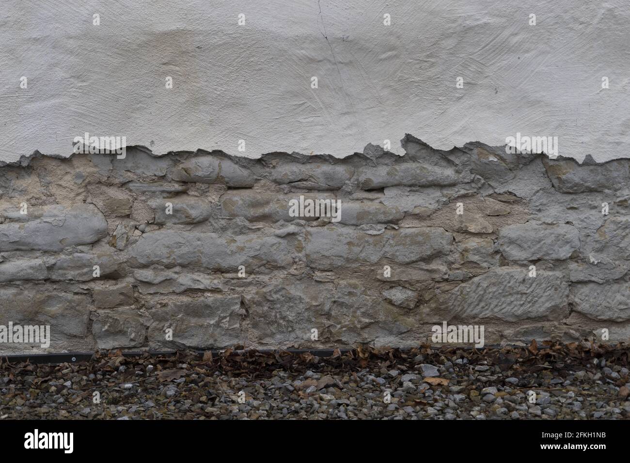 An old stone wall with weathered stucco and plaster Stock Photo - Alamy