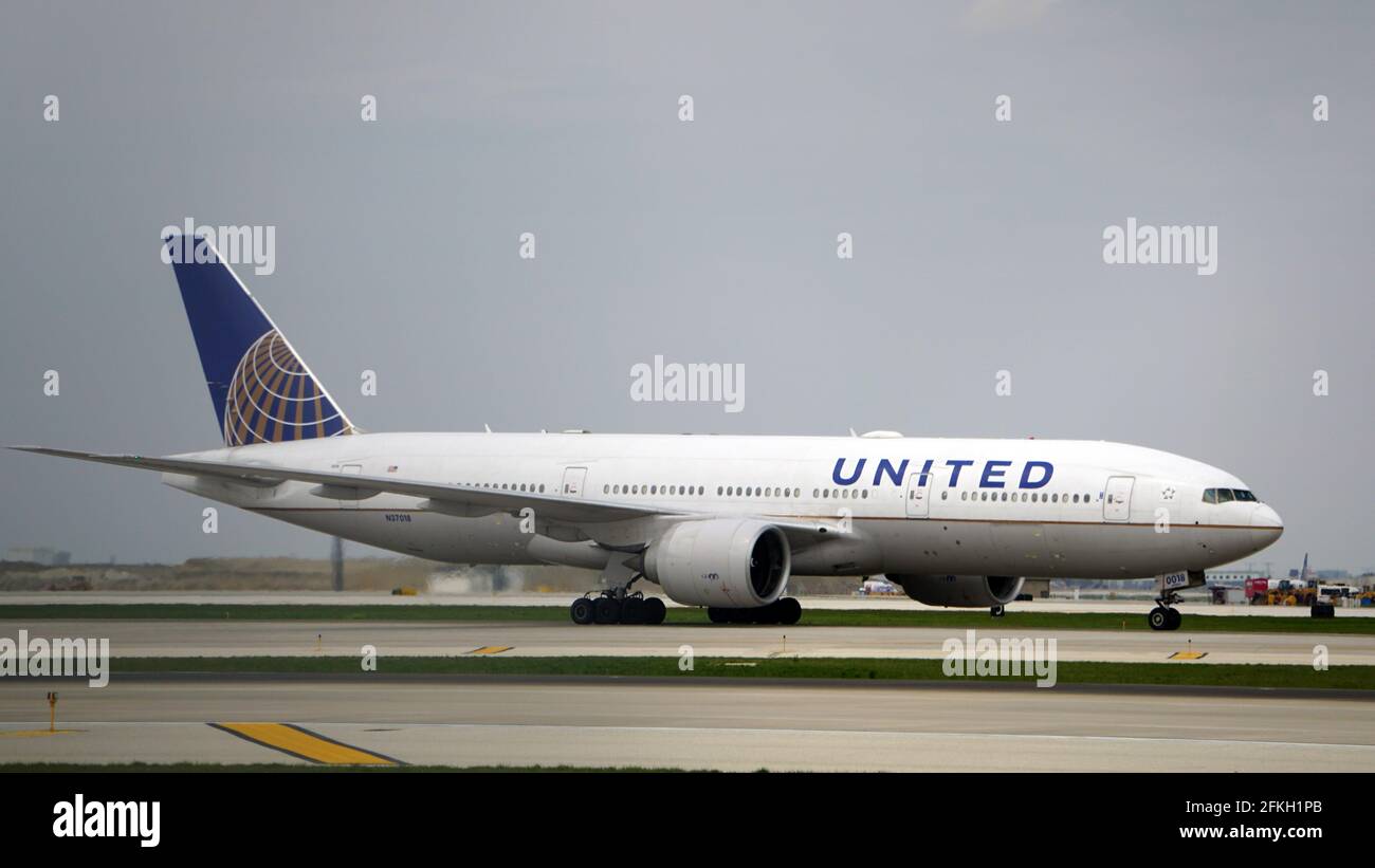 United Airlines Boeing 777 taxies on the runway after landing at ...