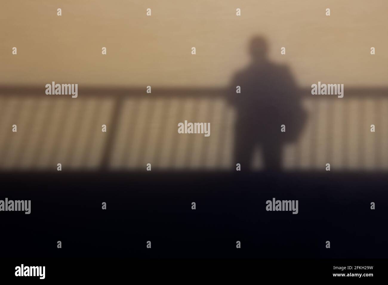 Man on railing hi-res stock photography and images - Alamy