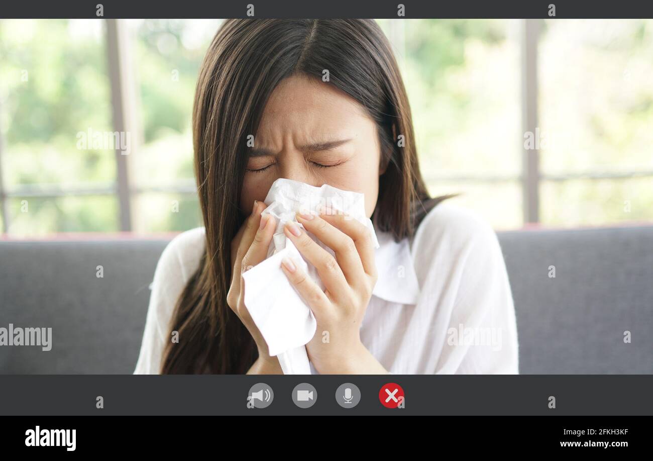 Screen application view of an Asian woman who is having the flu and is ...