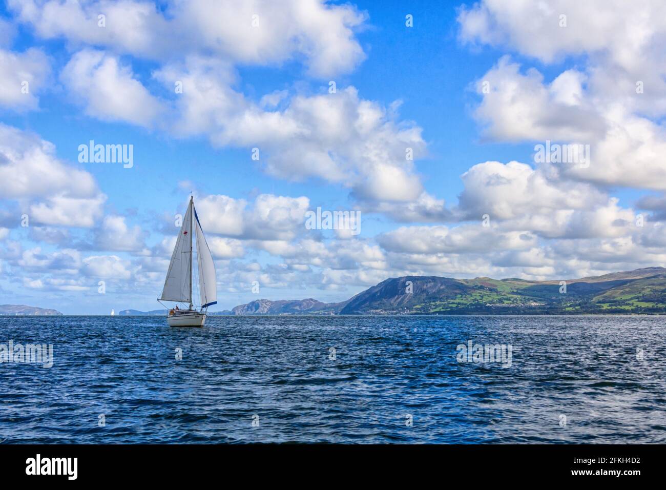 Yacht sailing in the Menai Straits bewteen Anglesey and the Welsh ...