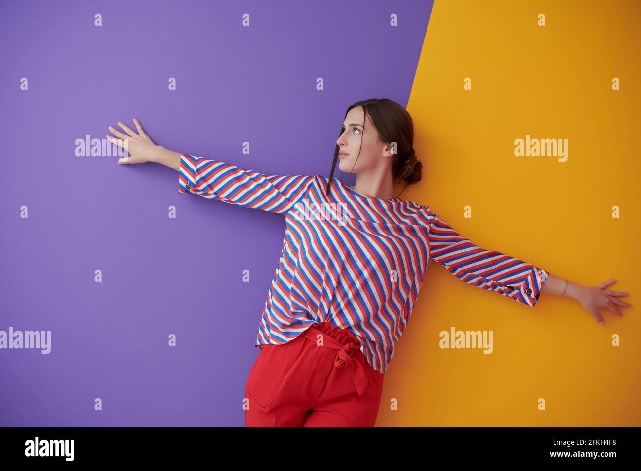 Young female model with open wide arms Stock Photo - Alamy