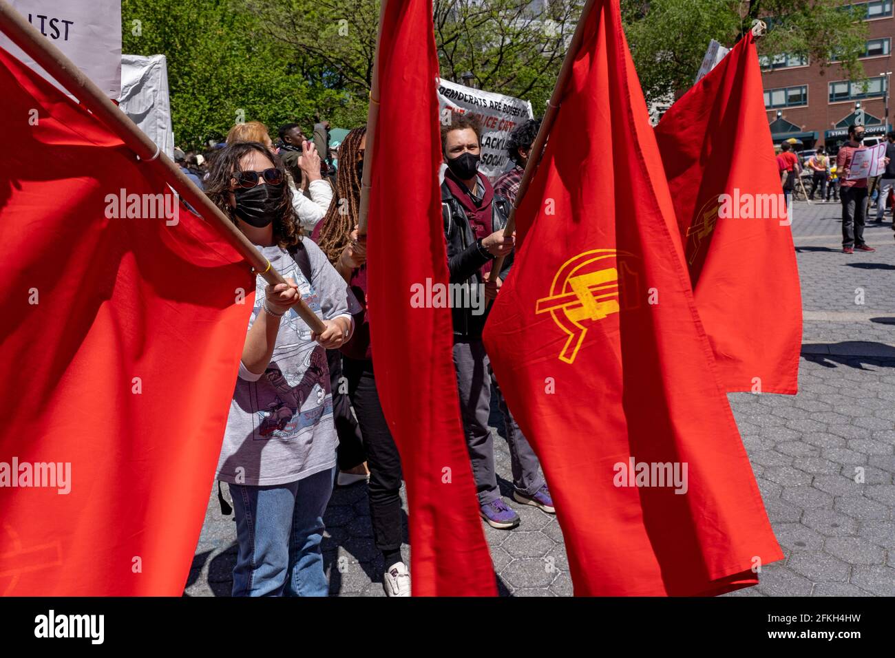 NEW YORK, NY - MAY 01: Attendees wave communist flags during the ...