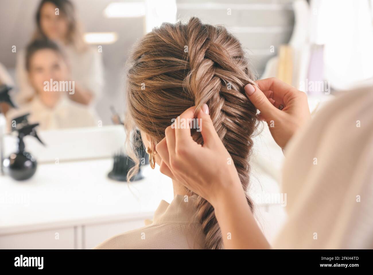 Hairdresser working with client in beauty salon Stock Photo - Alamy
