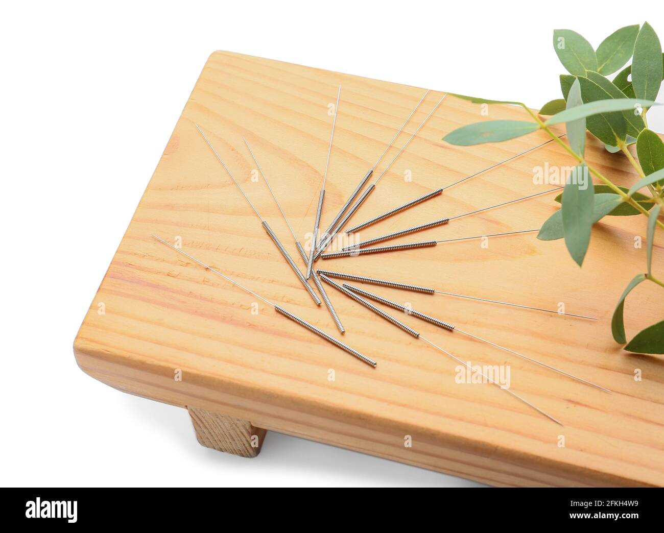 Stand with acupuncture needles on white background Stock Photo - Alamy