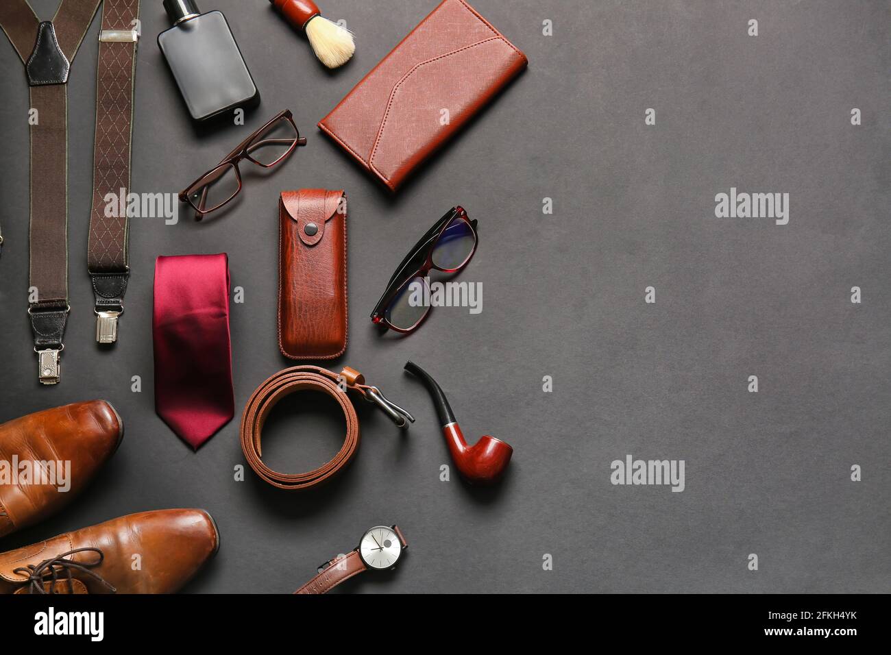 Stylish male accessories on dark background Stock Photo - Alamy