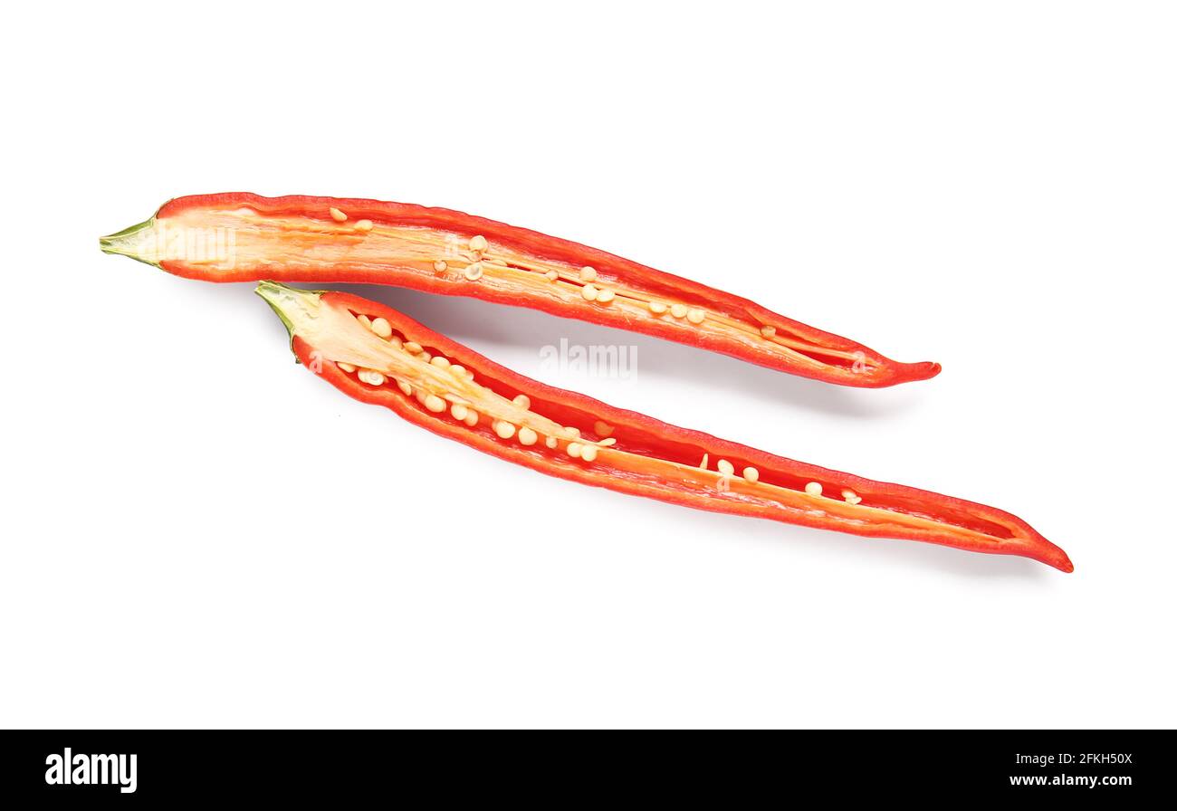 Cut fresh chili pepper on white background Stock Photo - Alamy