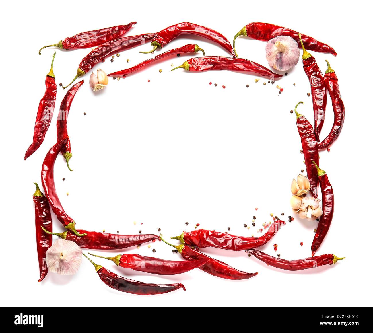 Frame made of dried chili peppers and garlic on white background Stock ...