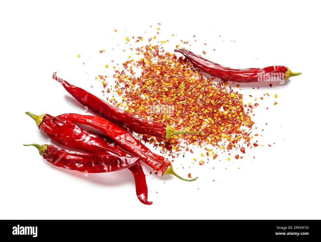 Dried chili peppers and red paprika on white background Stock Photo - Alamy