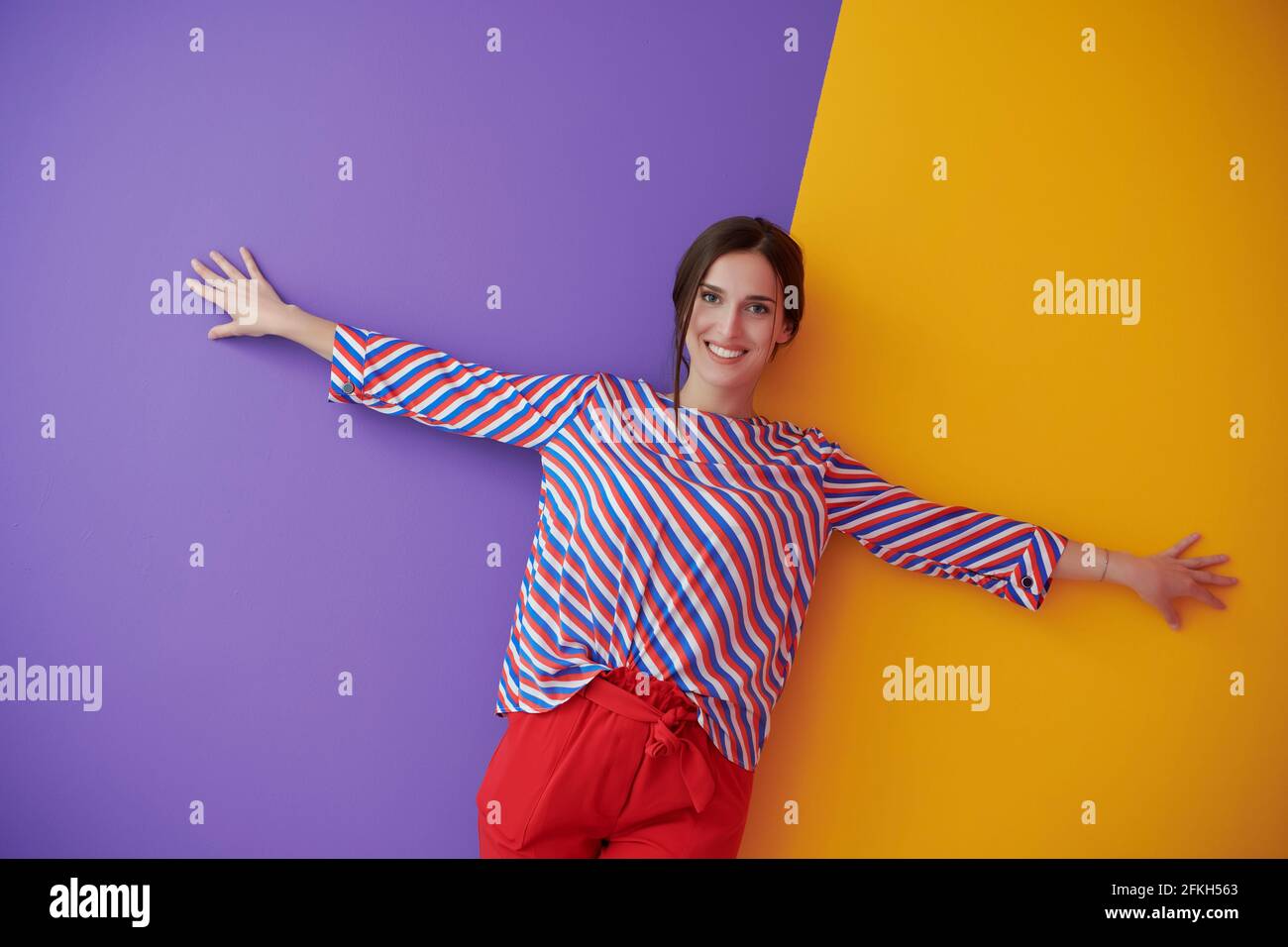 Young female model with open wide arms Stock Photo - Alamy