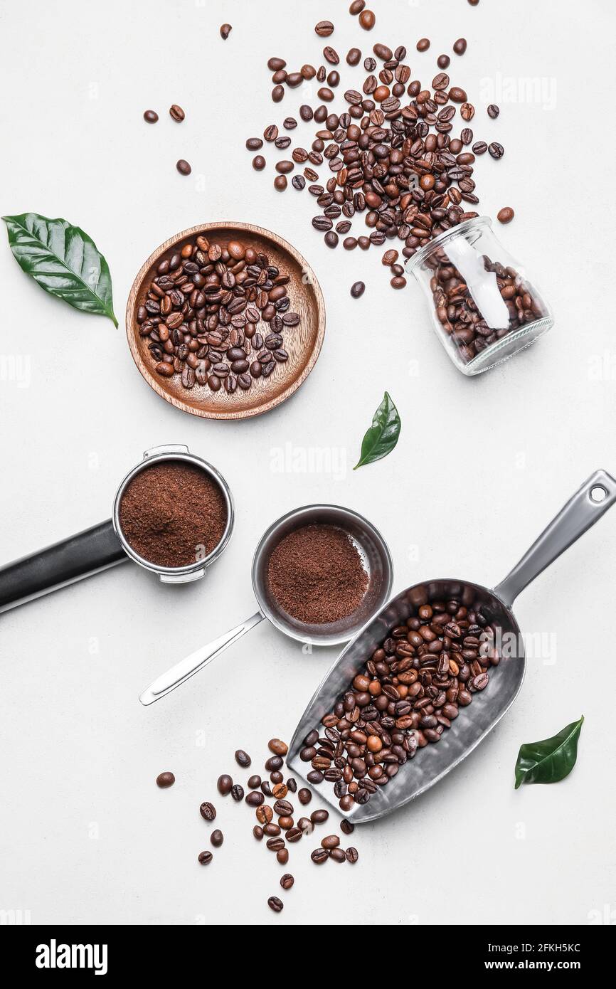 Composition with coffee beans and powder on light background Stock ...