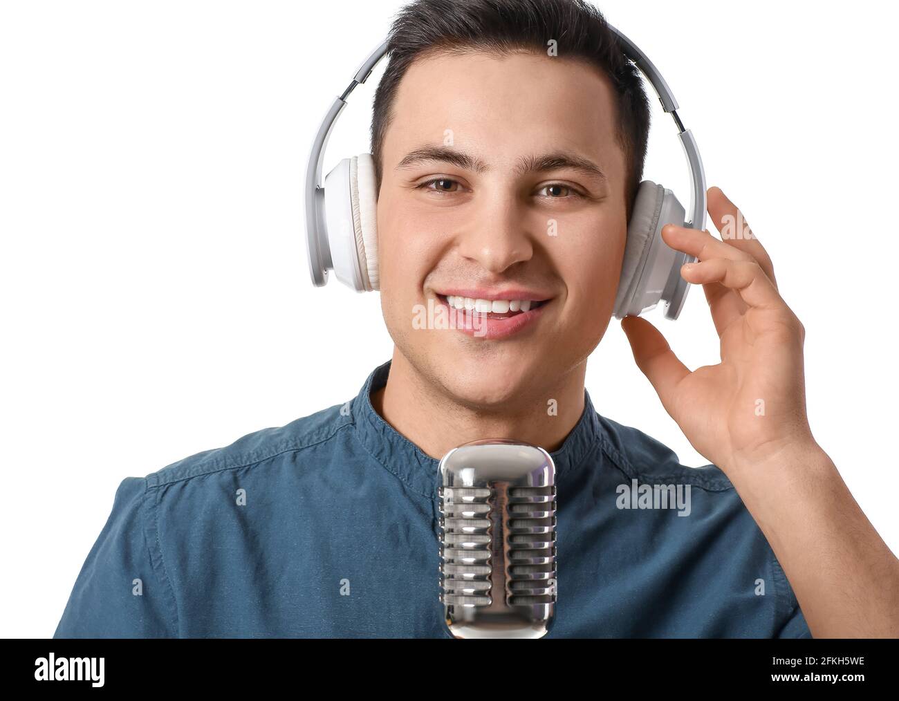 Male radio presenter with microphone on white background Stock Photo ...