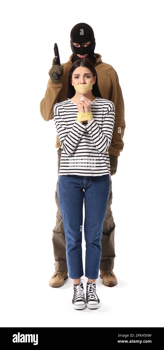 Terrorist with female hostage on white background Stock Photo - Alamy