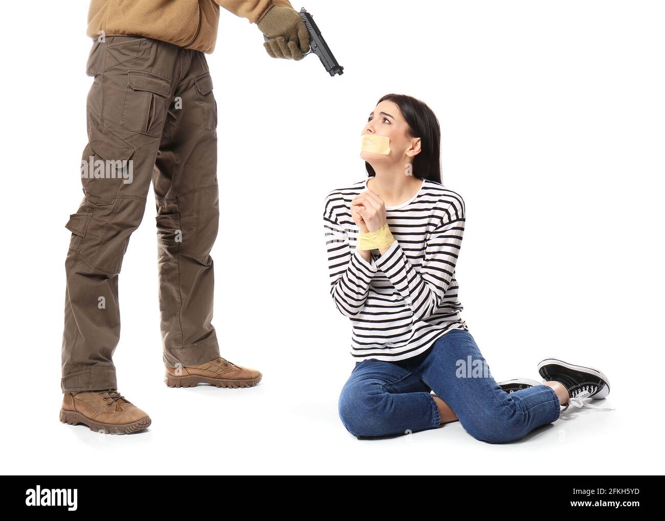 Terrorist with female hostage on white background Stock Photo - Alamy