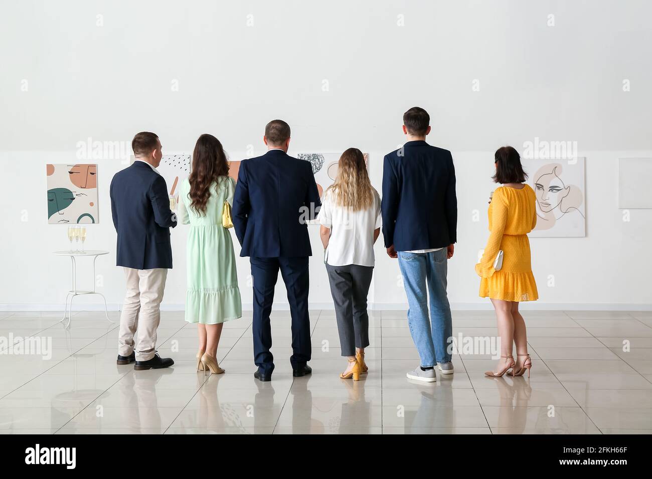 People at exhibition in modern art gallery Stock Photo - Alamy