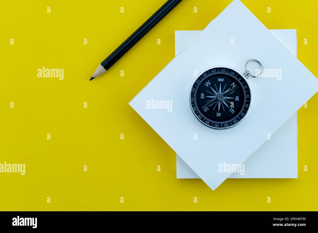 Top view business objects of white paper,pencil,and compass on paper ...