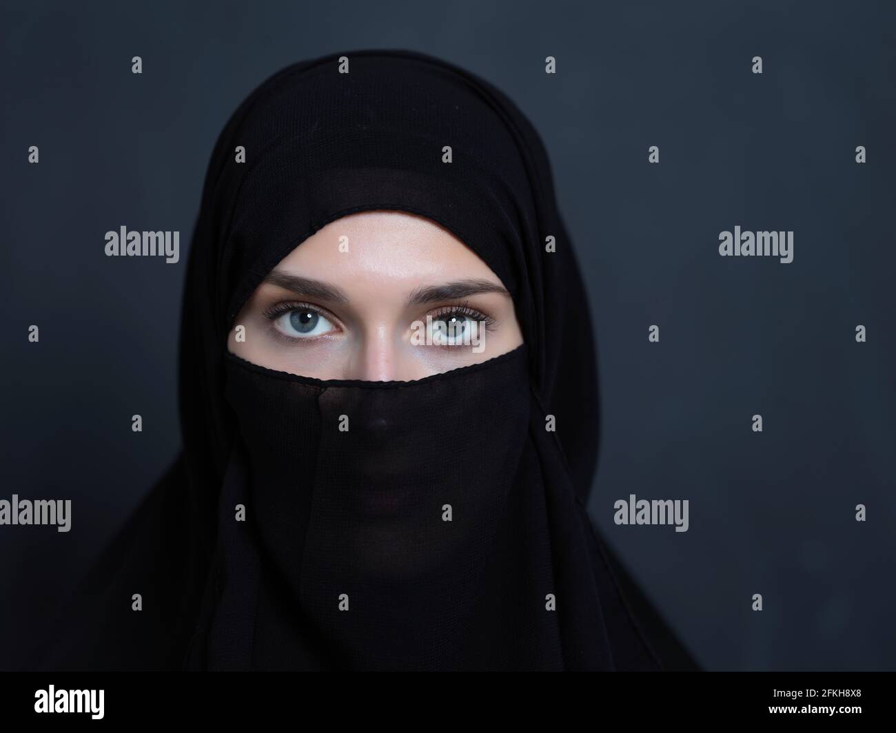 Portrait of muslim woman wearing niqab and traditional arabic clothes ...
