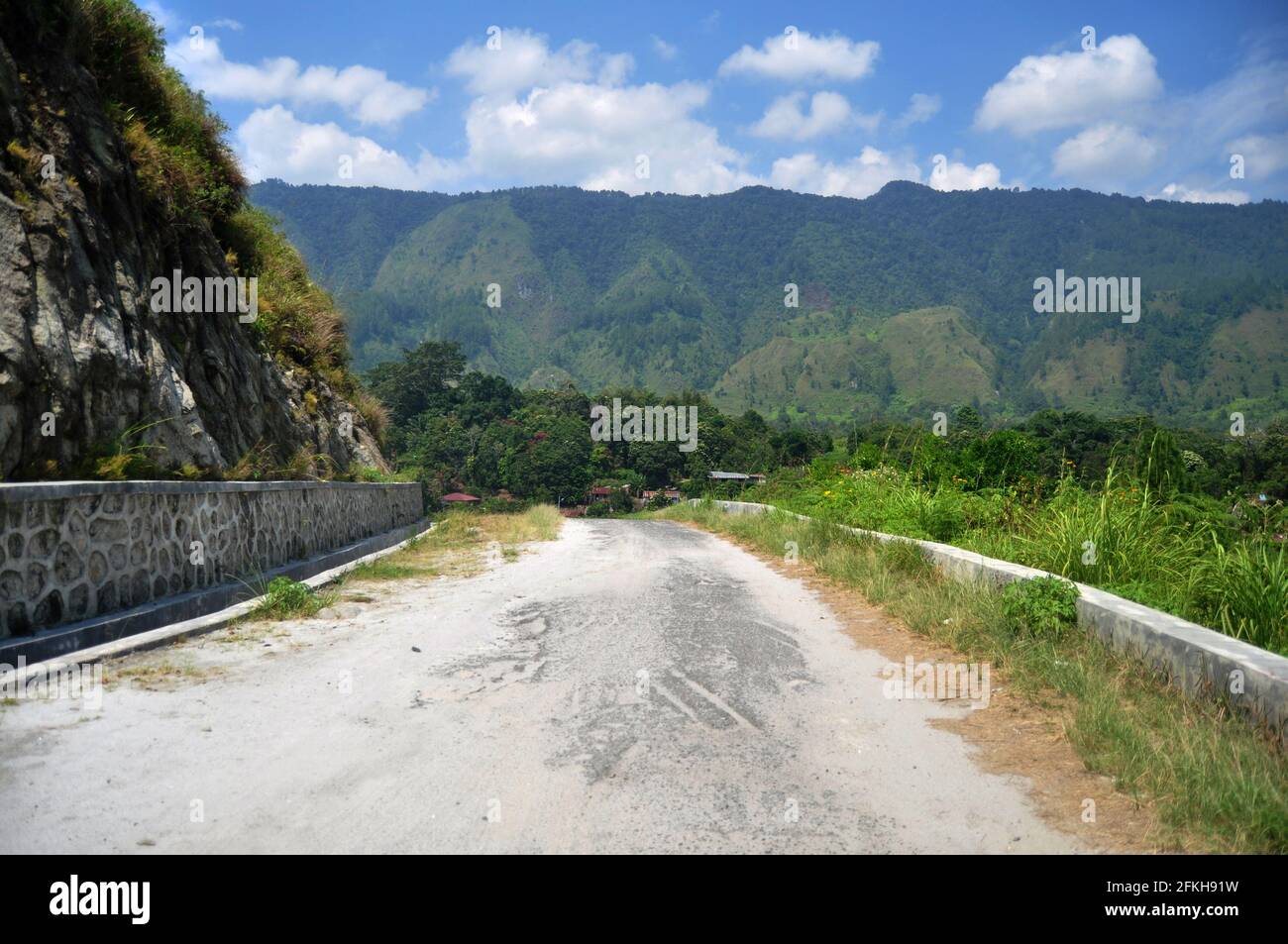 Local street road go to Sipiso Piso mountains beside Danau Toba Lake ...