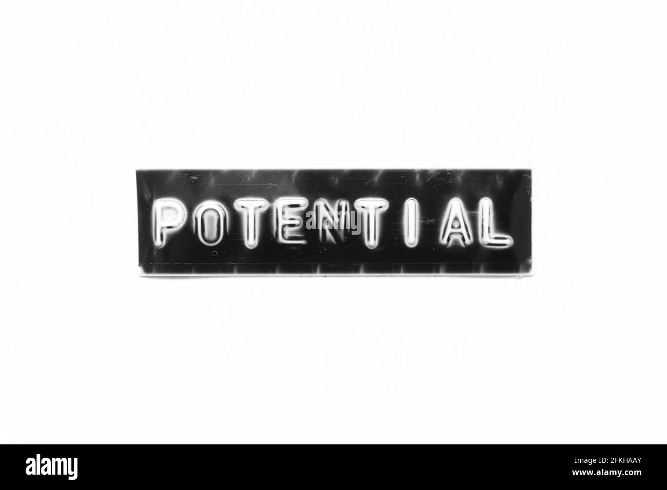 Embossed letter with word potential in black banner on white paper ...
