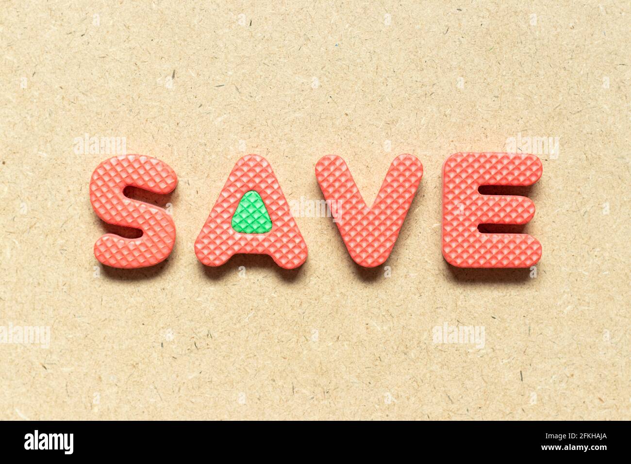 Foam alphabet letter in word save on wood background Stock Photo - Alamy