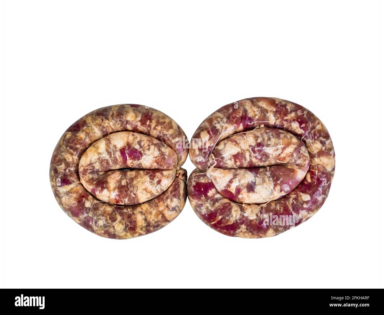 Ring of homemade meat sausage on a white plate. Pork meat. Raw pork ...