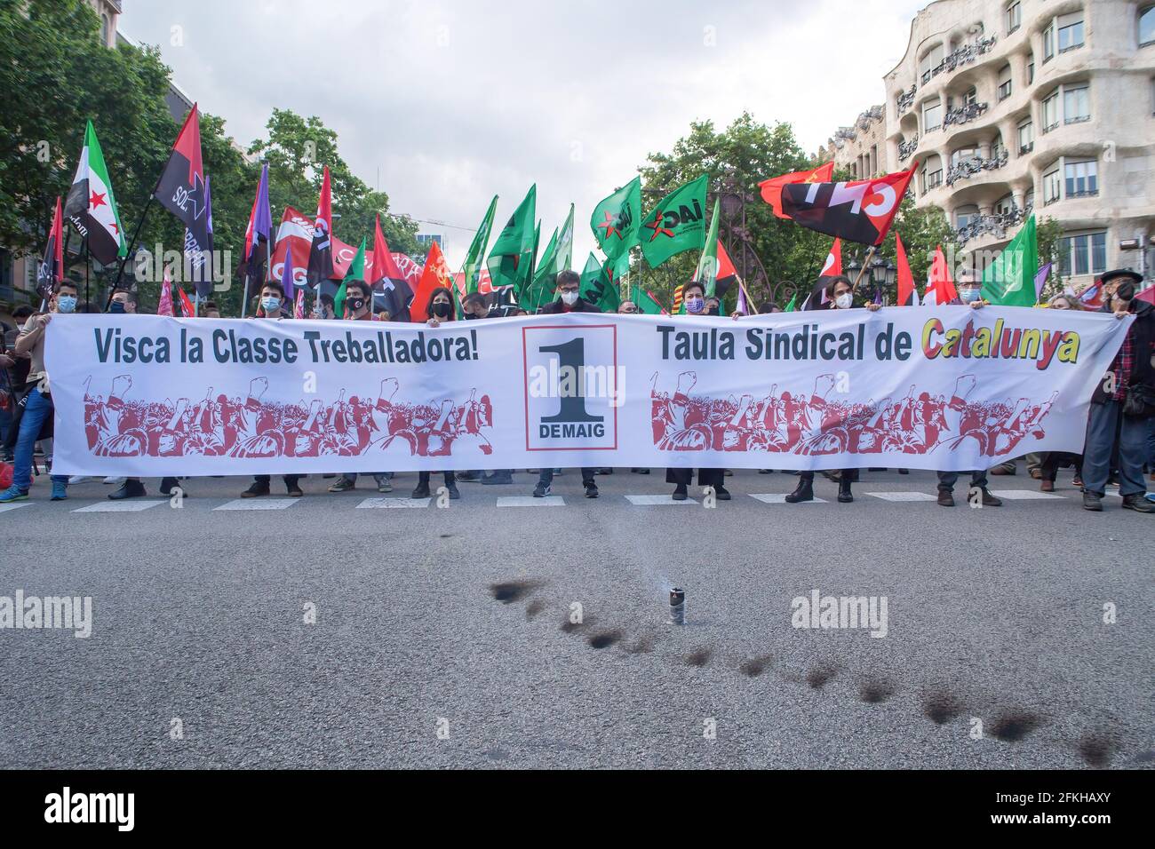 Barcelona, Spain. 01st May, 2021. Protesters seen with flags of workers ...