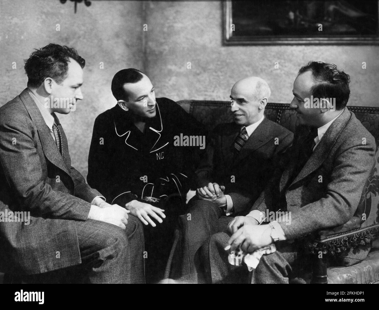 NOEL COWARD on set candid with CHARLES MacARTHUR (left) and BEN HECHT ...