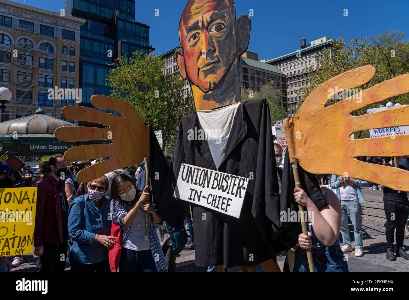 New York, United States. 01st May, 2021. People hold an effigy of Jeff ...