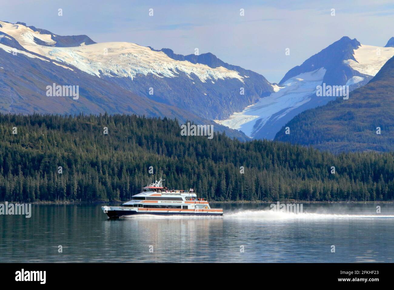 A Cruising boat in the fjord Alaska USA Stock Photo - Alamy