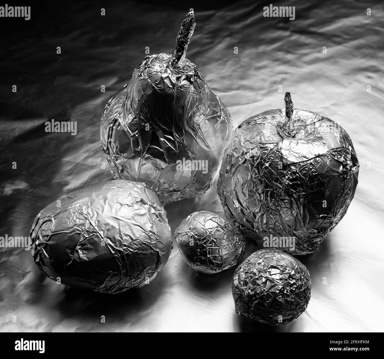 some fruits covered with aluminum foil Stock Photo - Alamy