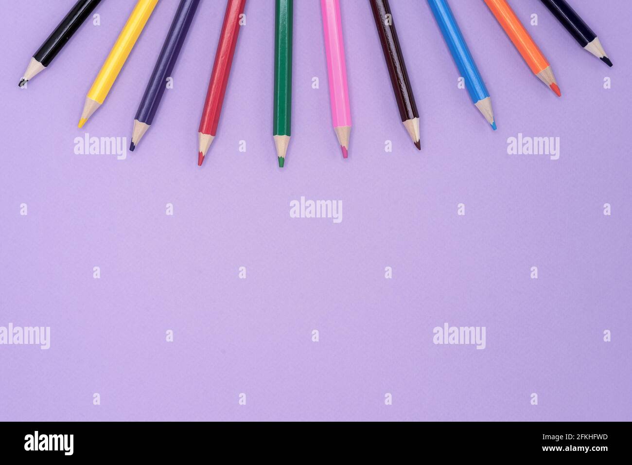 Colored pencils for drawing. Lilac background with pencils Stock Photo ...