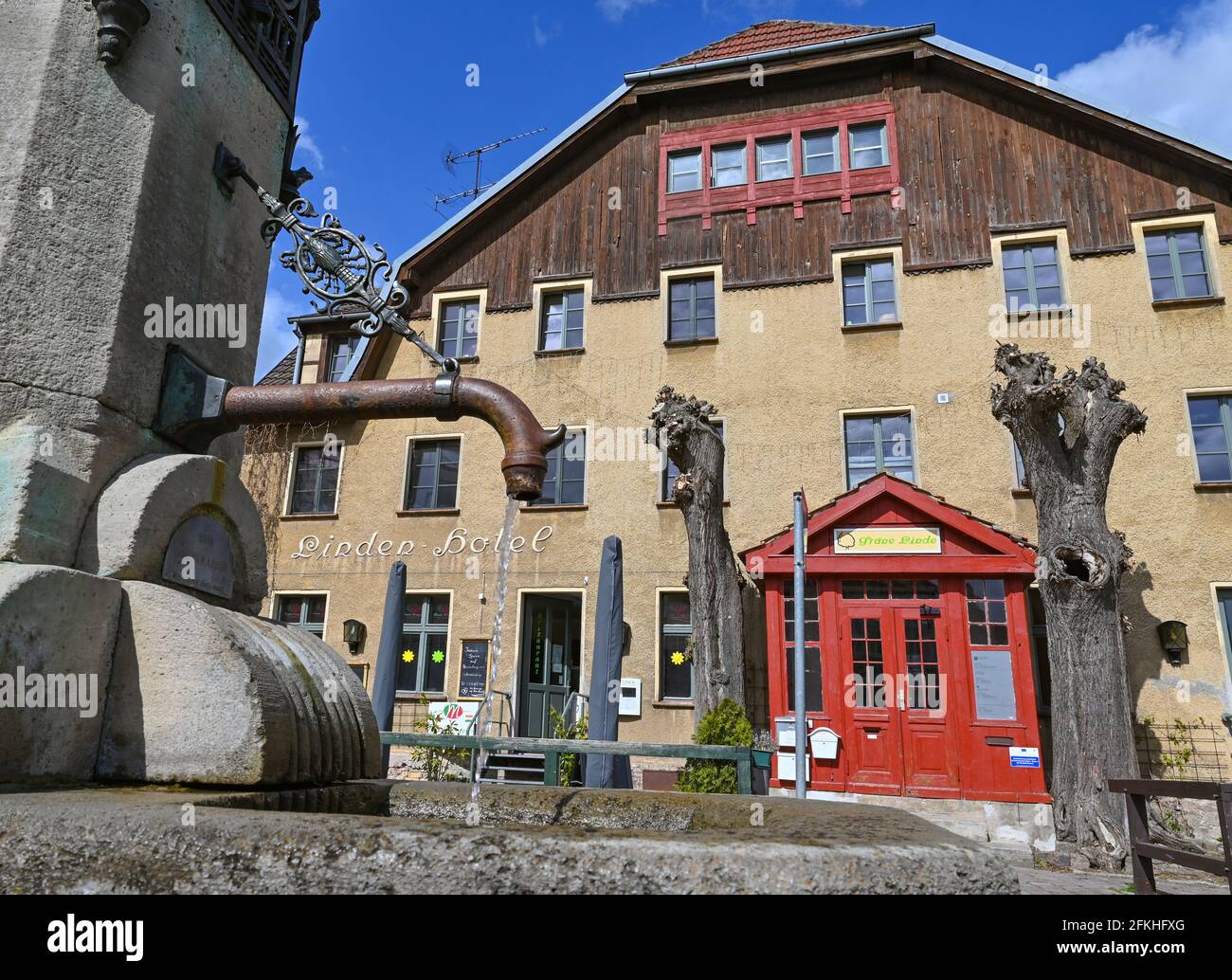 Buckow, Germany. 22nd Apr, 2021. A fountain stands in the centre of the ...