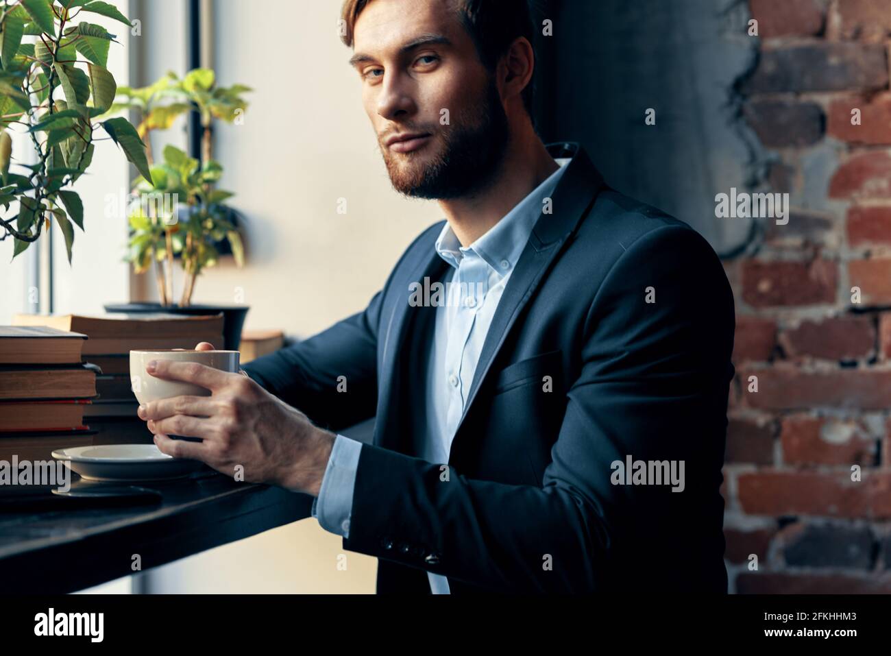 business man in a cafe suit drinking cafe rest breakfast Stock Photo ...