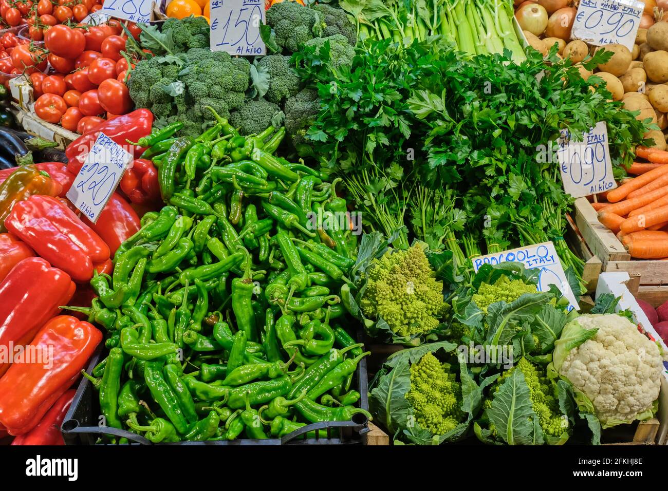 Chili, broccoli and other vegetables for sale at a market Stock Photo ...