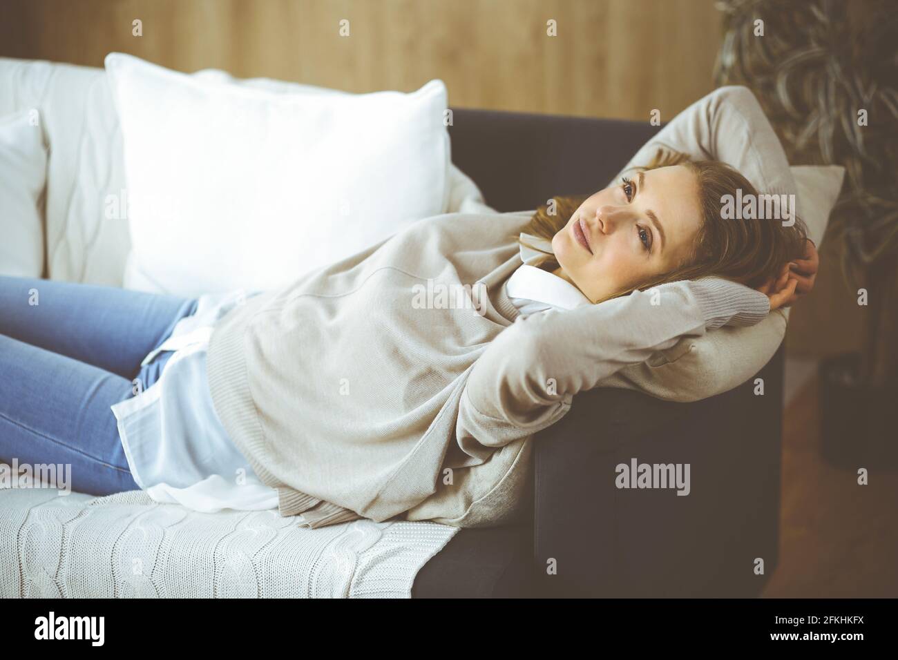 Barefoot Girl Lying On Couch High Resolution Stock Photography and ...