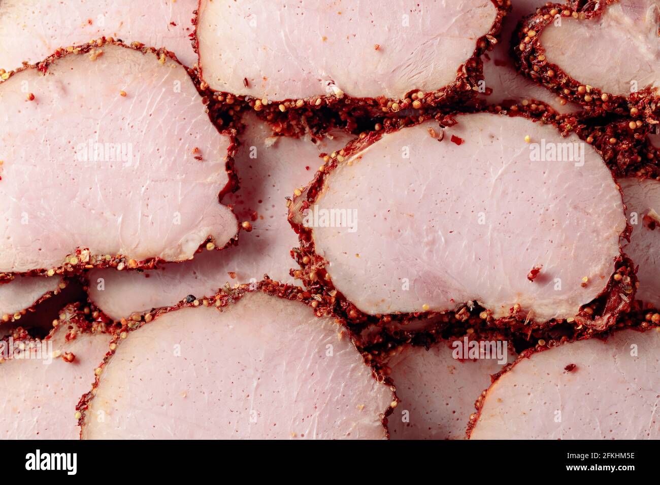 Slices of spicy smoked ham. Top view Stock Photo - Alamy